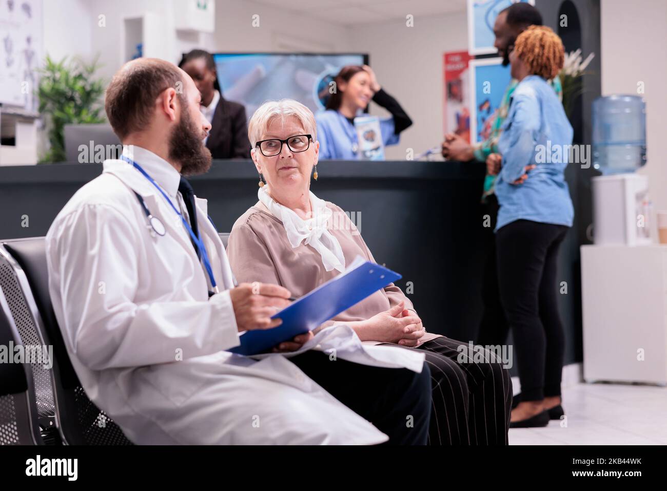 Older Receptionist Patient Interviewing Can The Hospital Front Desk