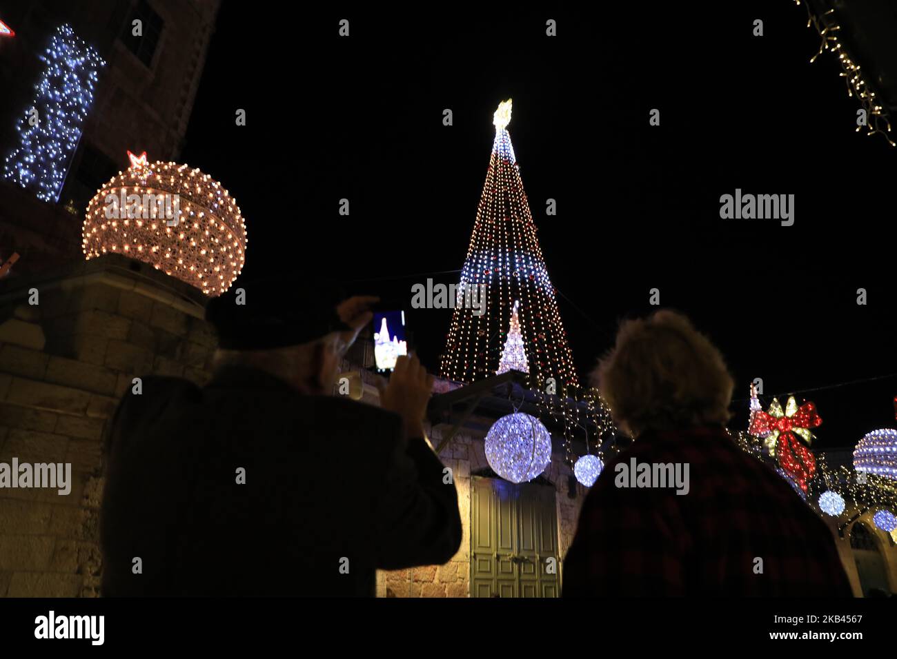 Thousands of Palestinians in East Jerusalem, Israel, lit up the Christmas tree on Saturday 15 ...
