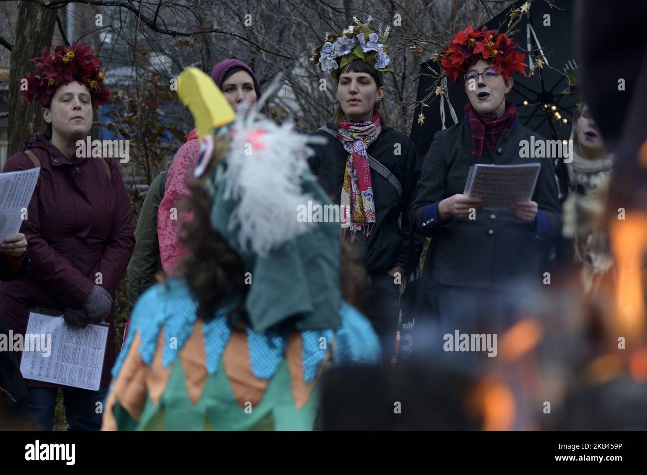 At a bonfire a choir sings traditional slavic songs as hundreds ...