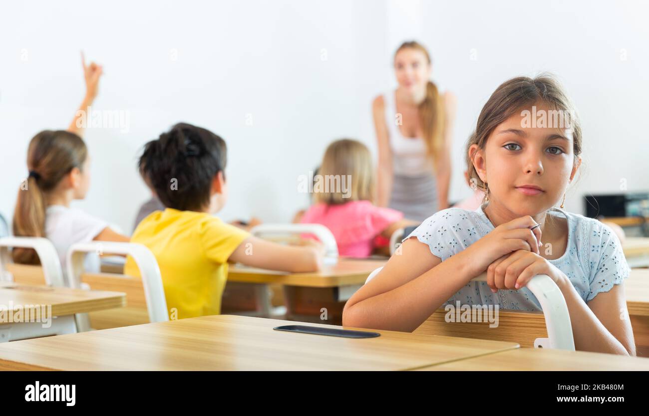 Young girl in classroom Stock Photo - Alamy