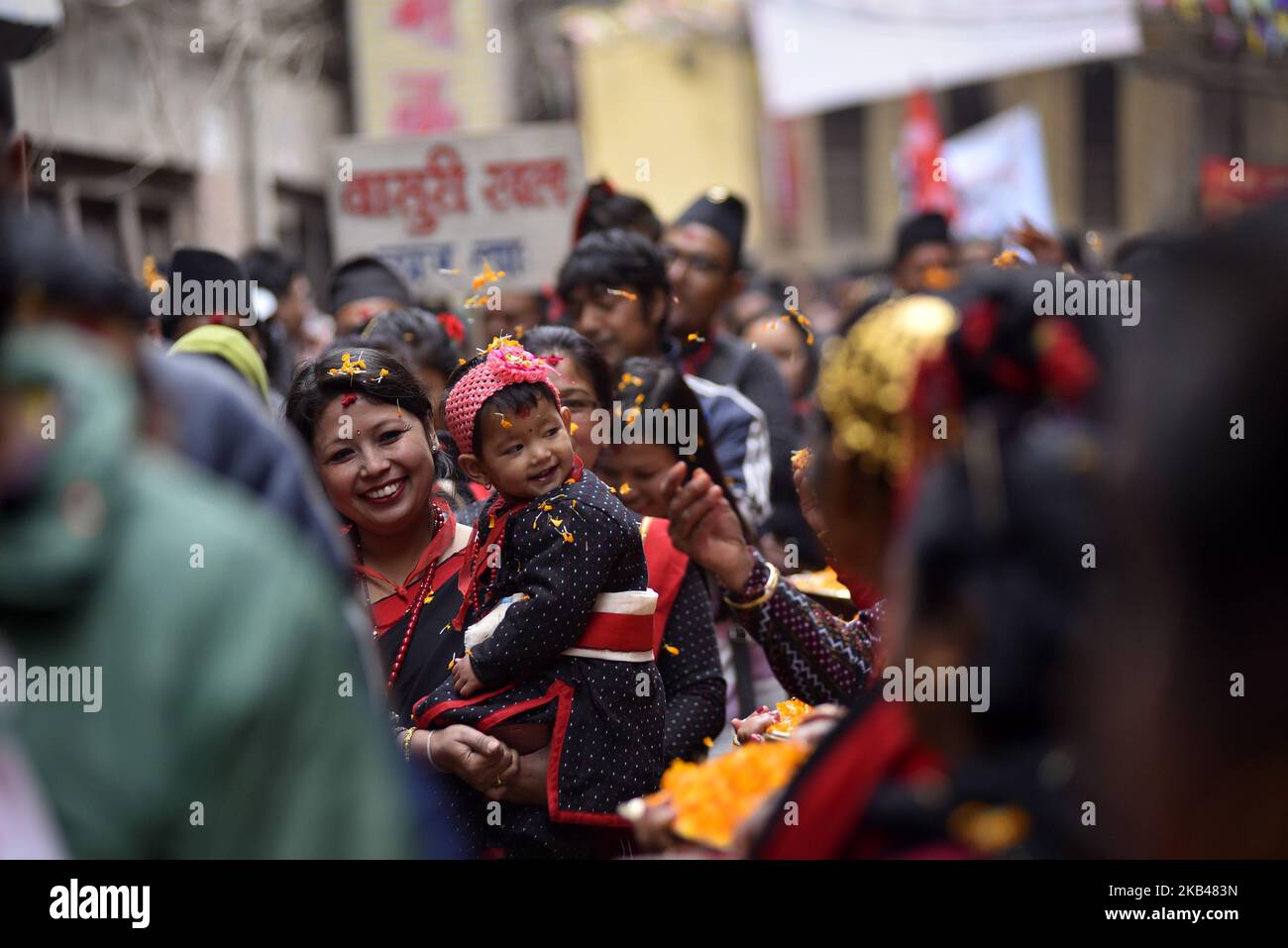 People from Newar community welcome people by spreading flower in a ...
