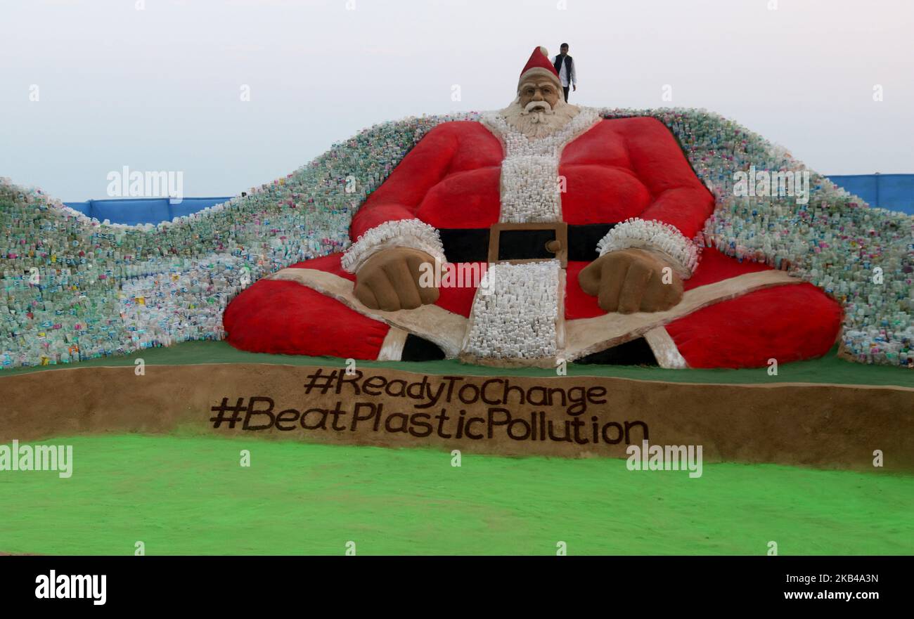 A sand Santa Claus is seen as it is made sand with plastic bottles ...