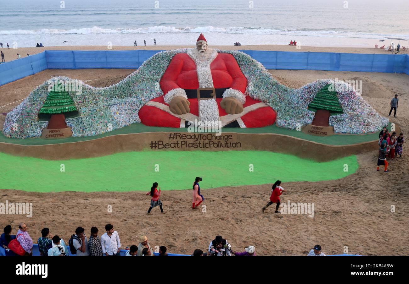 A sand Santa Claus is seen as it is made sand with plastic bottles ...