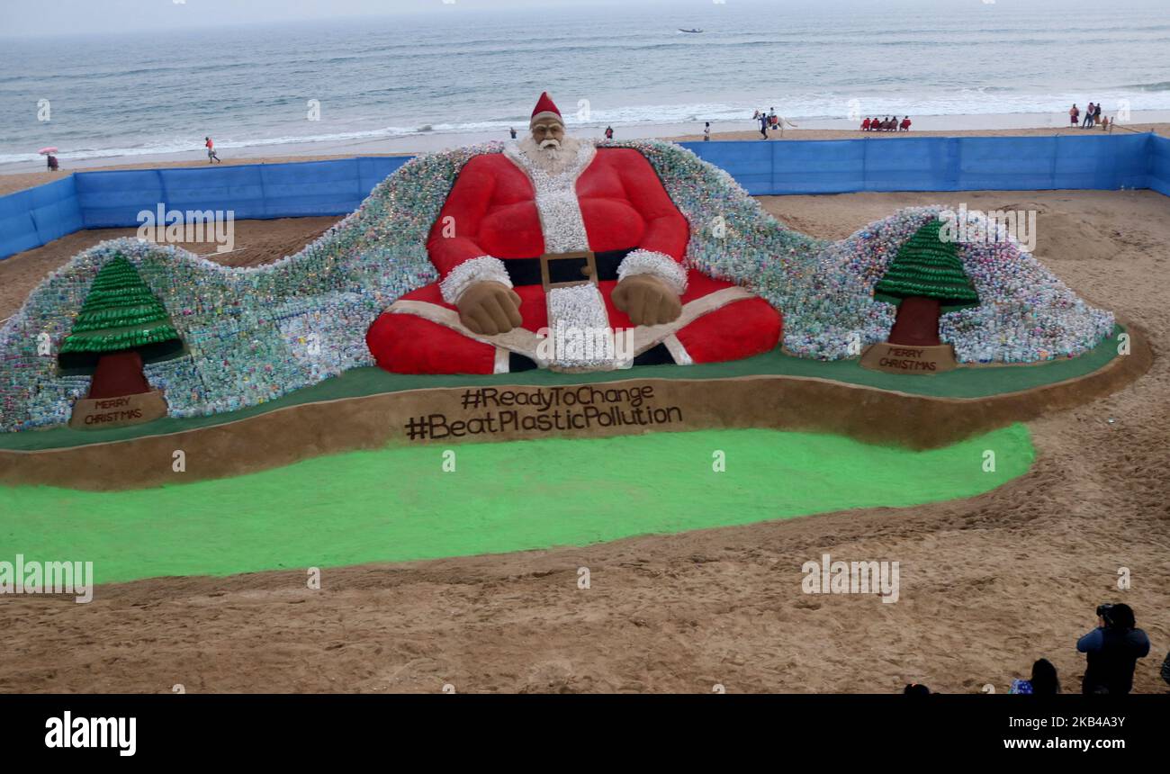 A sand Santa Claus is seen as it is made sand with plastic bottles ...