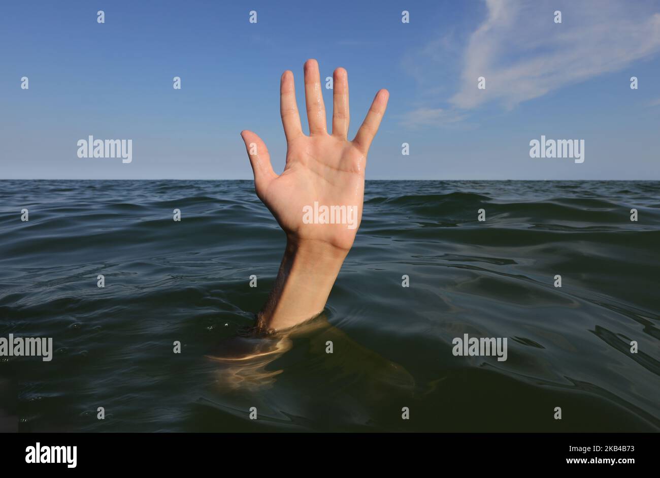 hand in the water of sea of a person who is drowning and seeks help ...