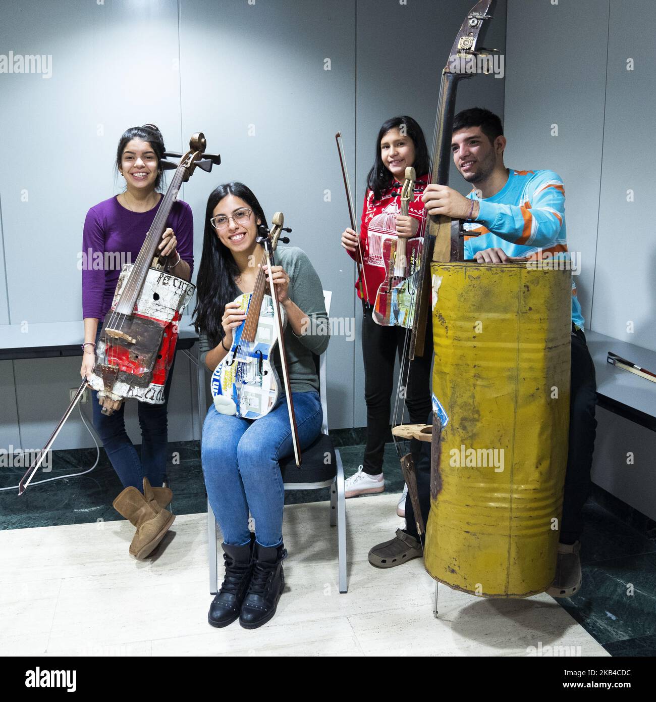 a young musician shows an instrument during the presentation of the ...
