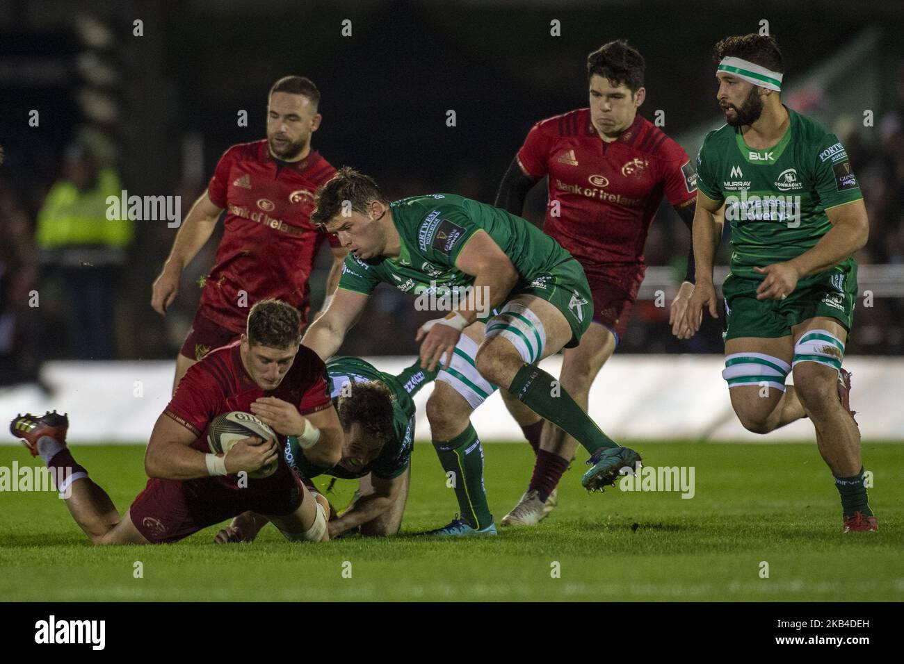 Dan Goggin of Munster tackled by Jack Carty of Connacht during the ...