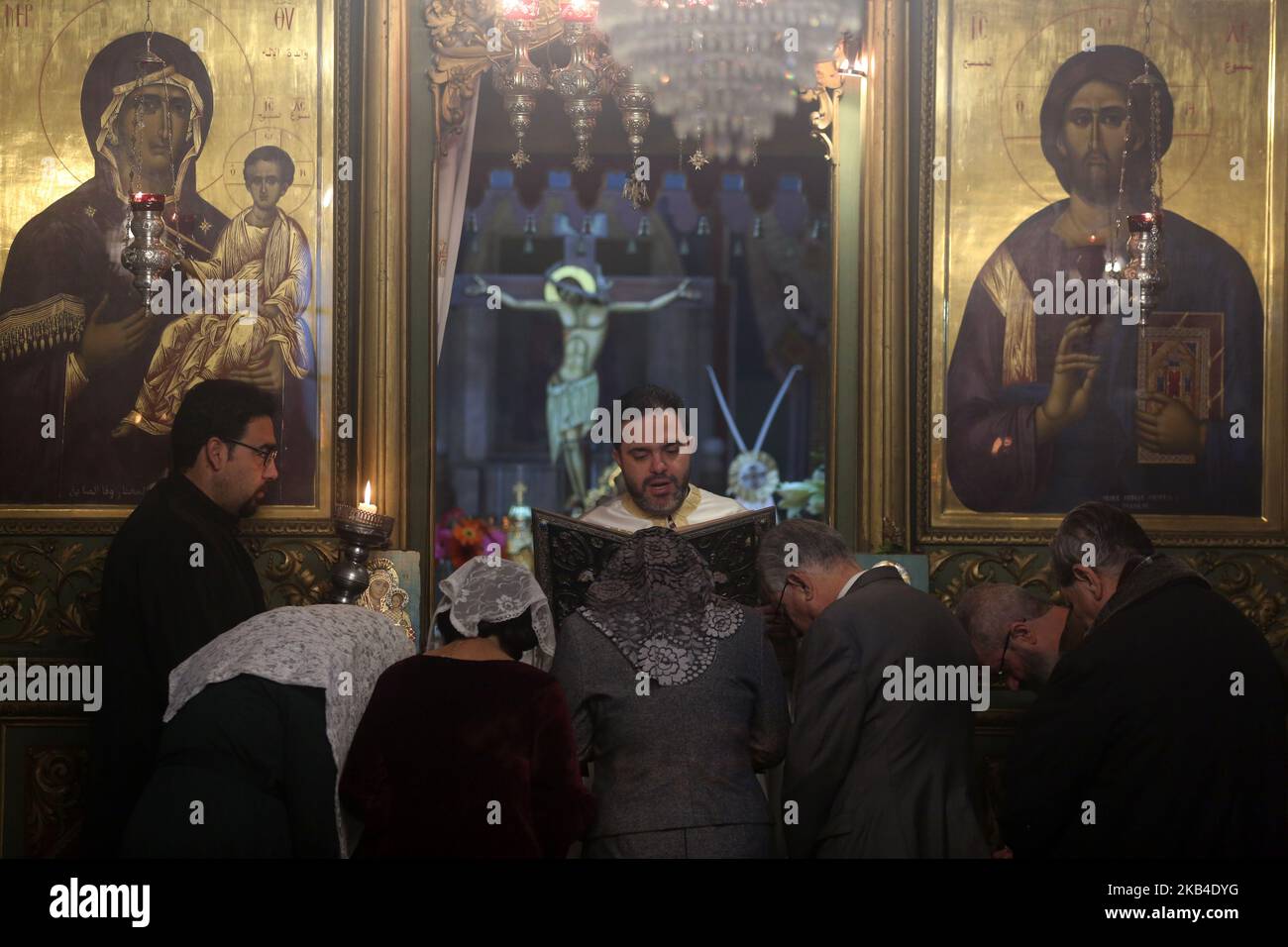Palestinian Orthodox Christians attend a mass in the Church of Saint ...