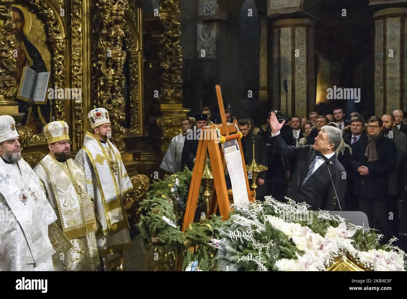 Ukrainian President Petro Poroshenko (R) speaks in front of the Tomos ...