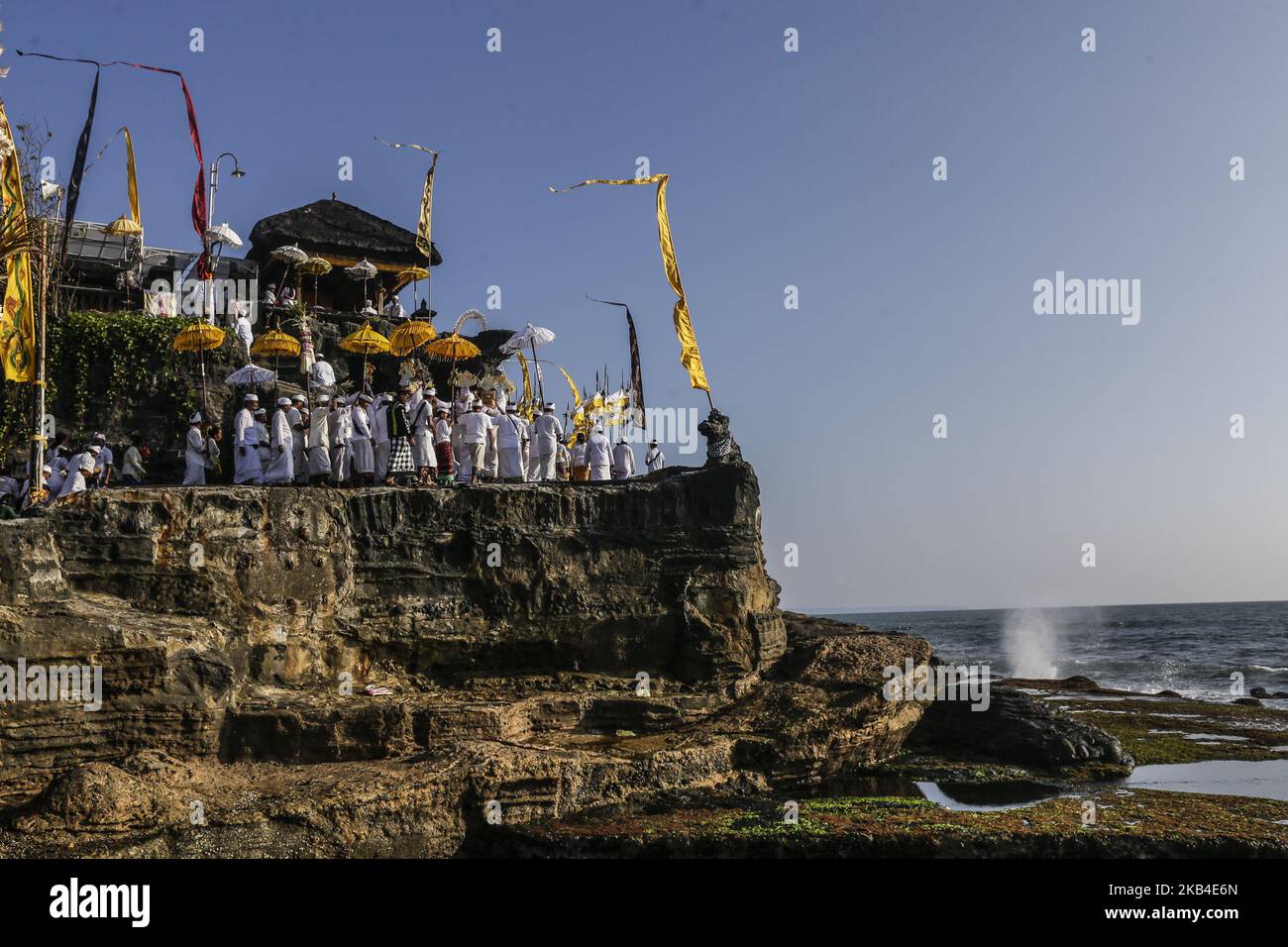 Indonesia devotees ngebejan tabanan tanah lot temple pujawali ceremony ...