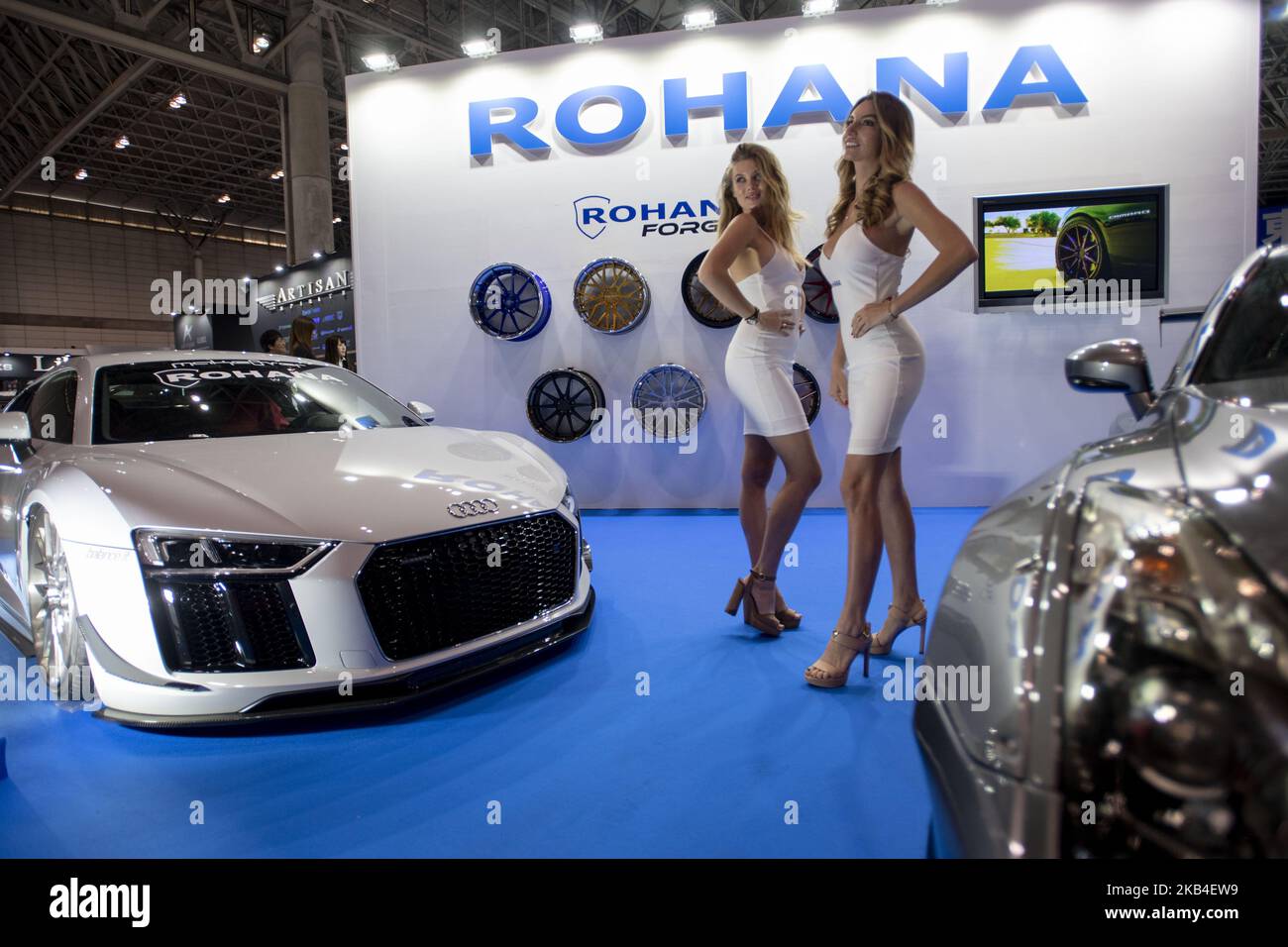 A campaign model poses for visitors during the Tokyo Auto Salon 2019 in ...