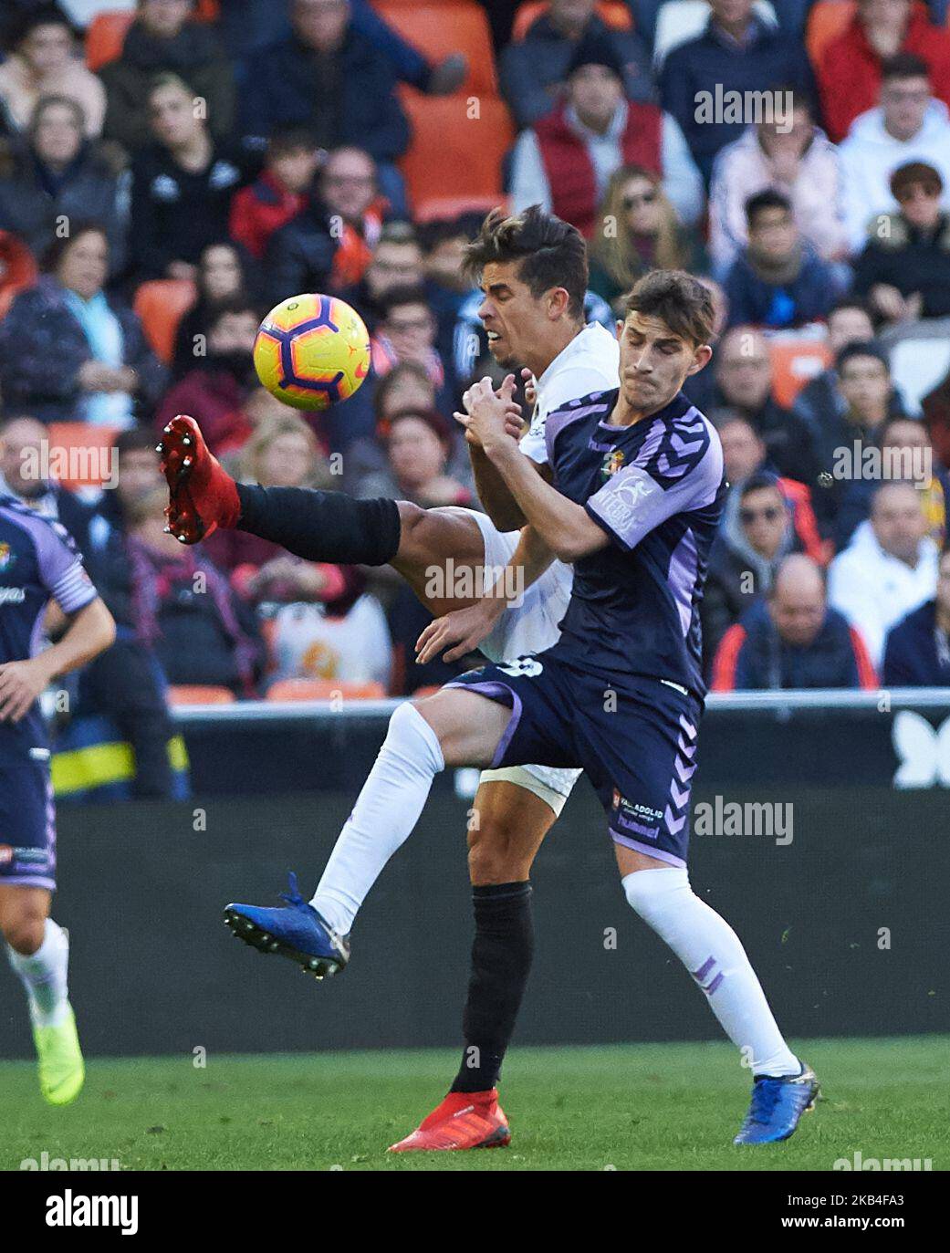 Gabriel Paulista of Valencia CF and Toni Villa of Valladolid during the ...