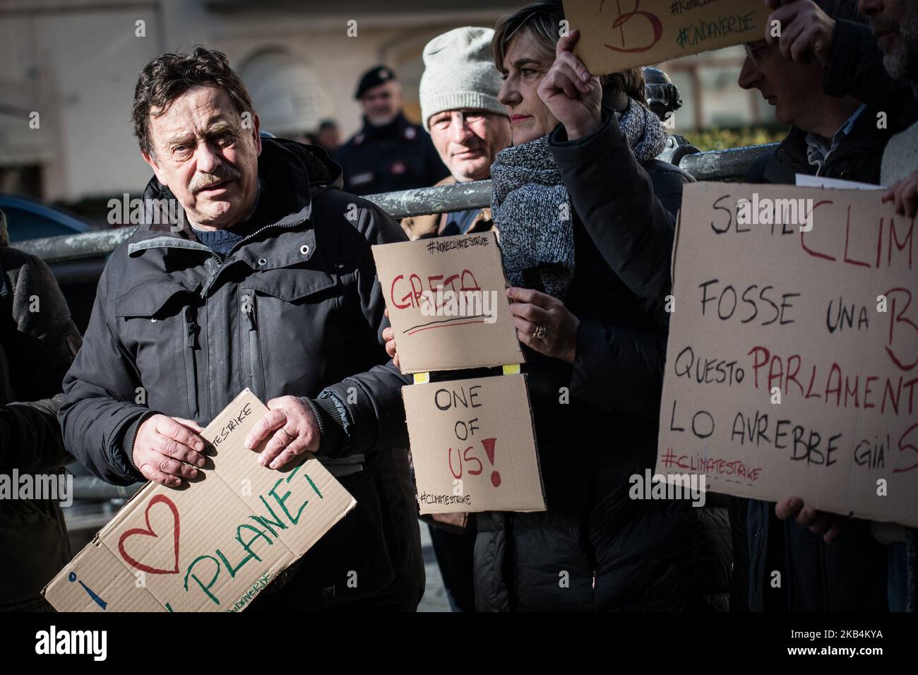 A protester protests against the inefficiency of policies on climate ...