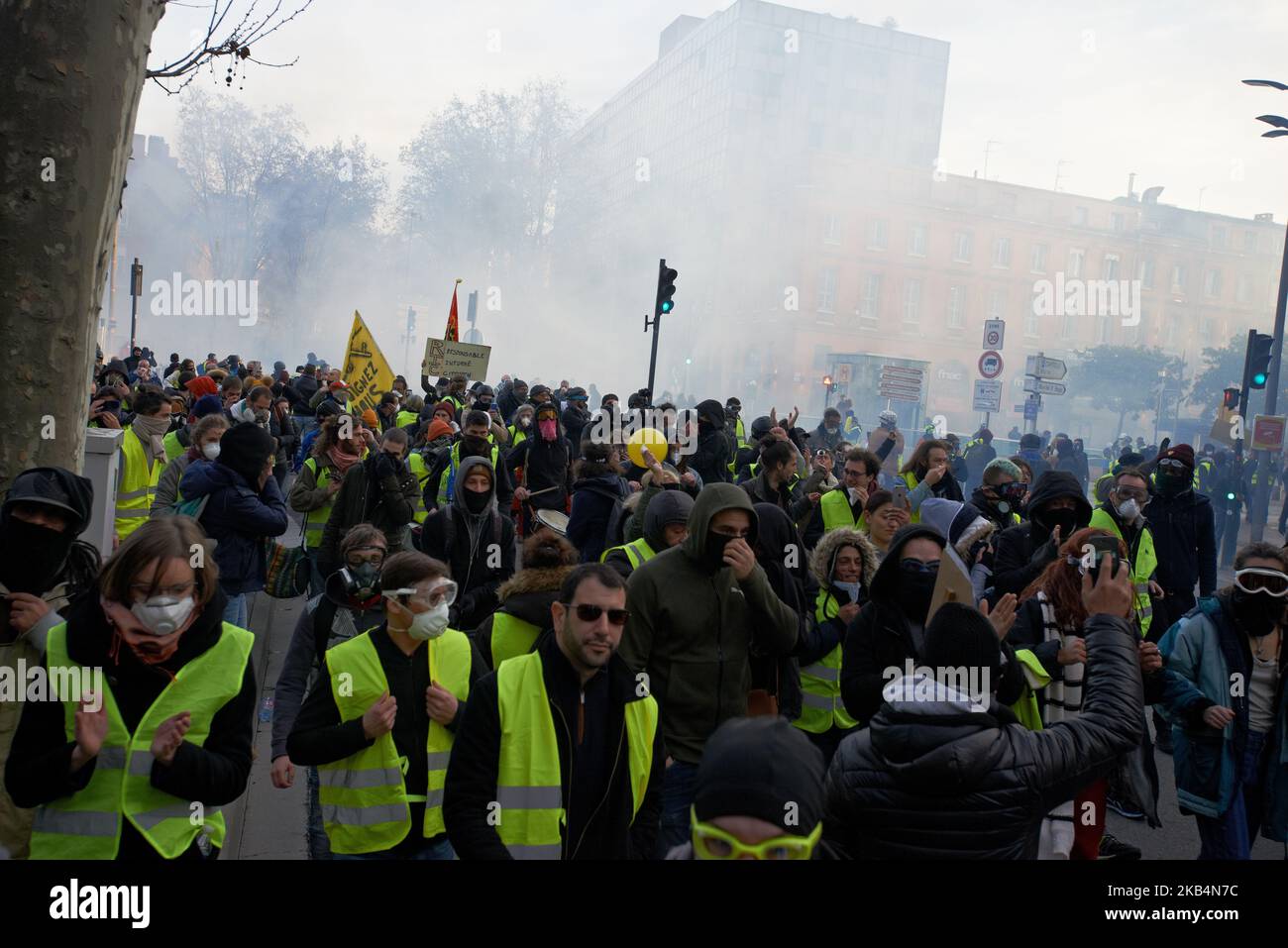 Riot police cut the protest in two by using volleys of tear gas ...