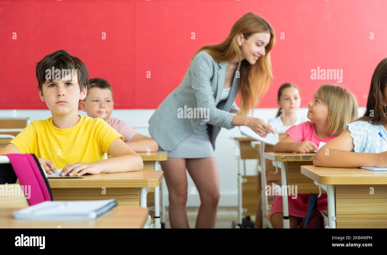 Kids sitting in classroom Stock Photo - Alamy