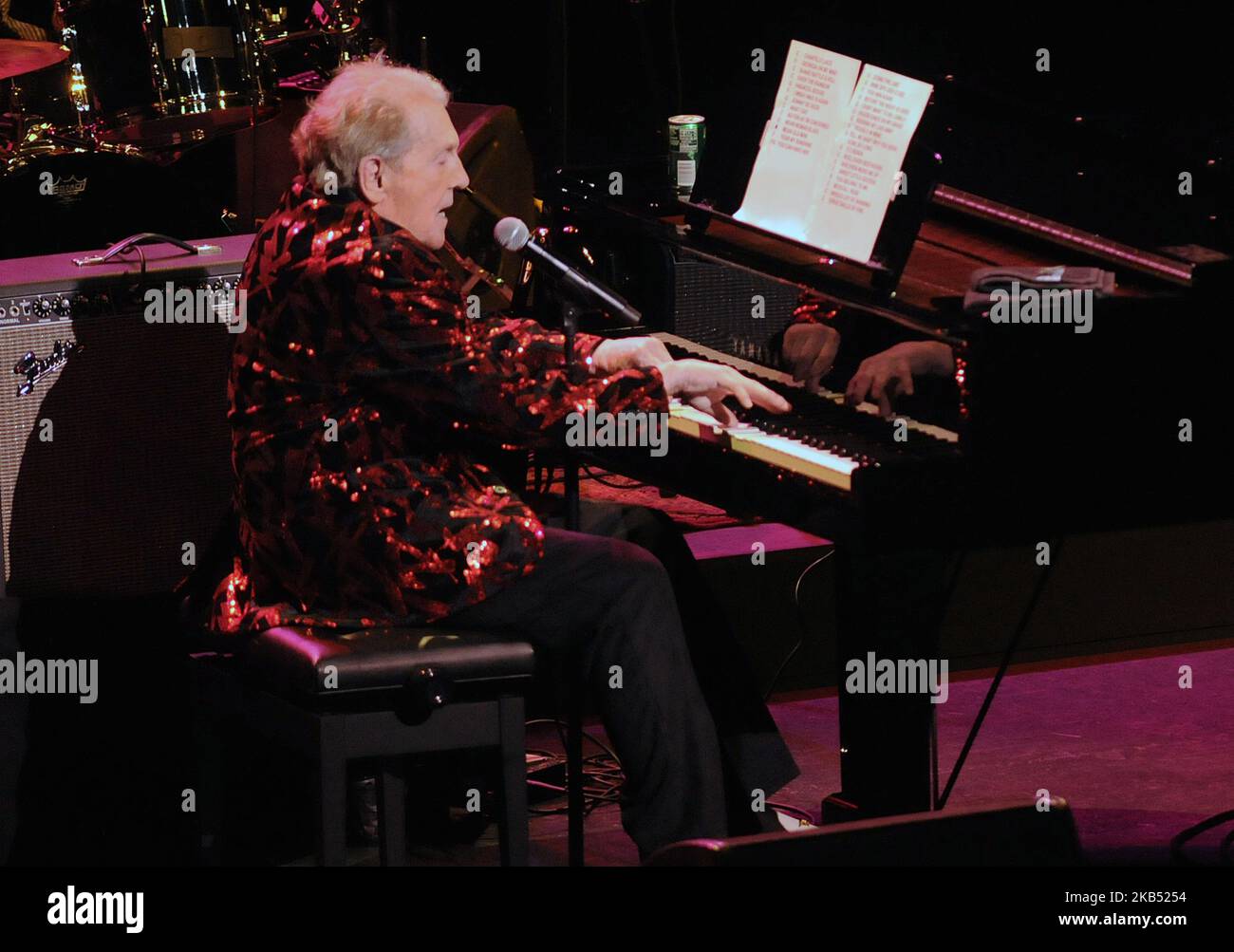 Rock and roll pioneer Jerry Lee Lewis performs on stage with his band ...