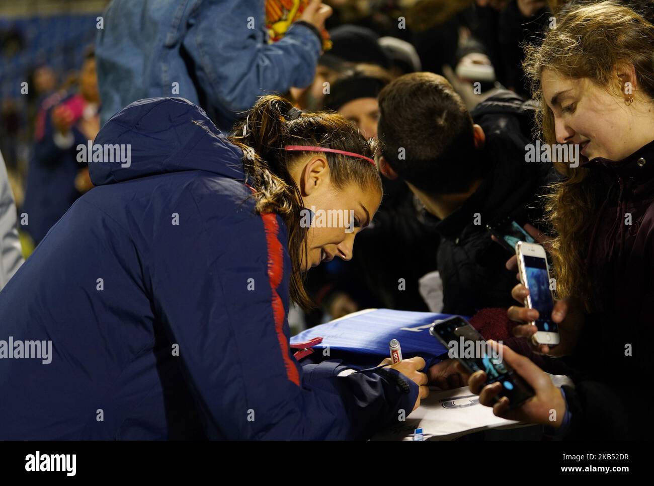 Alex Morgan of The United States taking time for fans during pregame ...