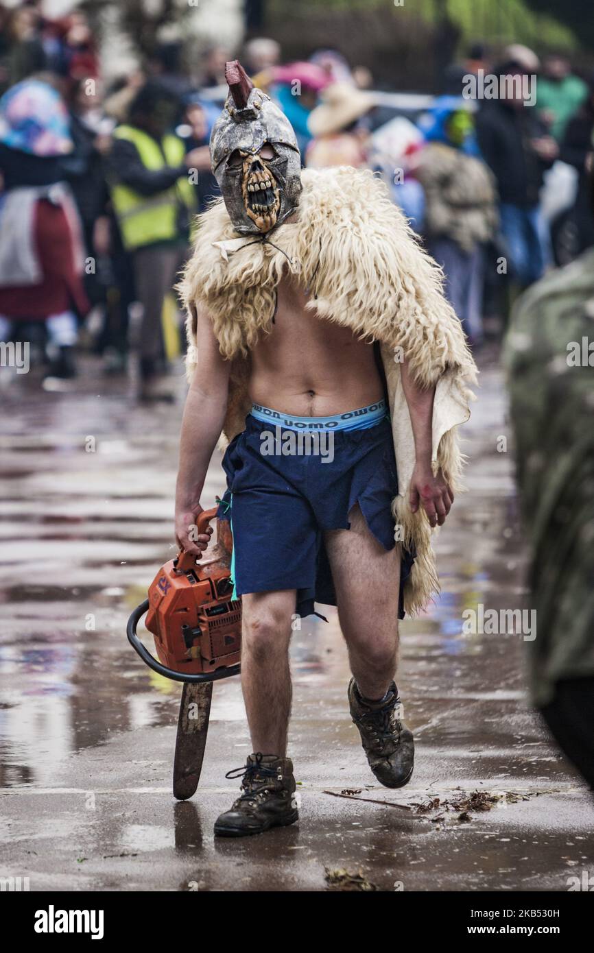 Participant of the Ituren carnival dressed with a terror costume makes ...