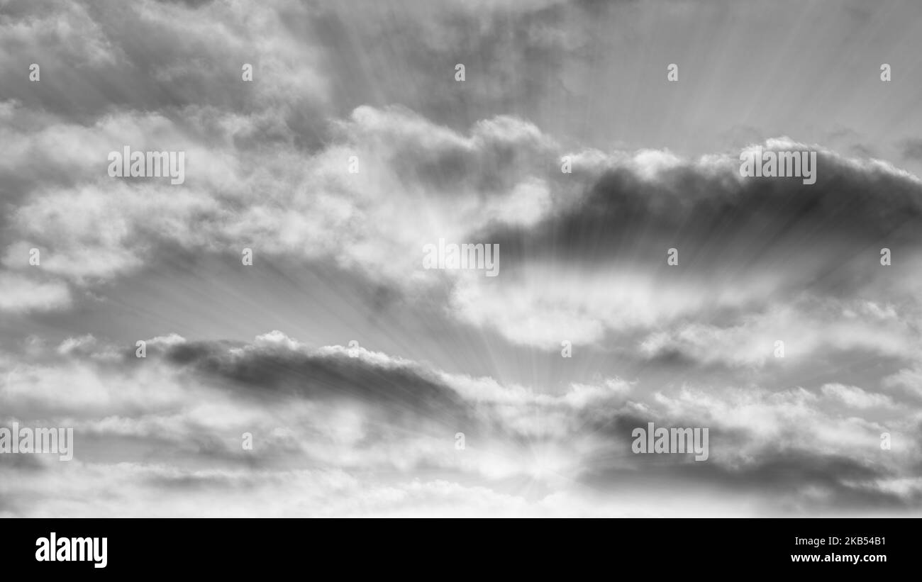 A Bright Daytime Sky With Sun Rays Emanating From The Clouds In 16.9 ...