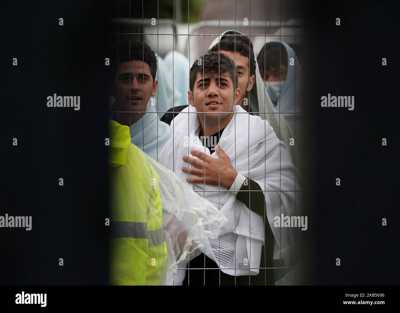 A view of people thought to be migrants inside the Manston immigration ...