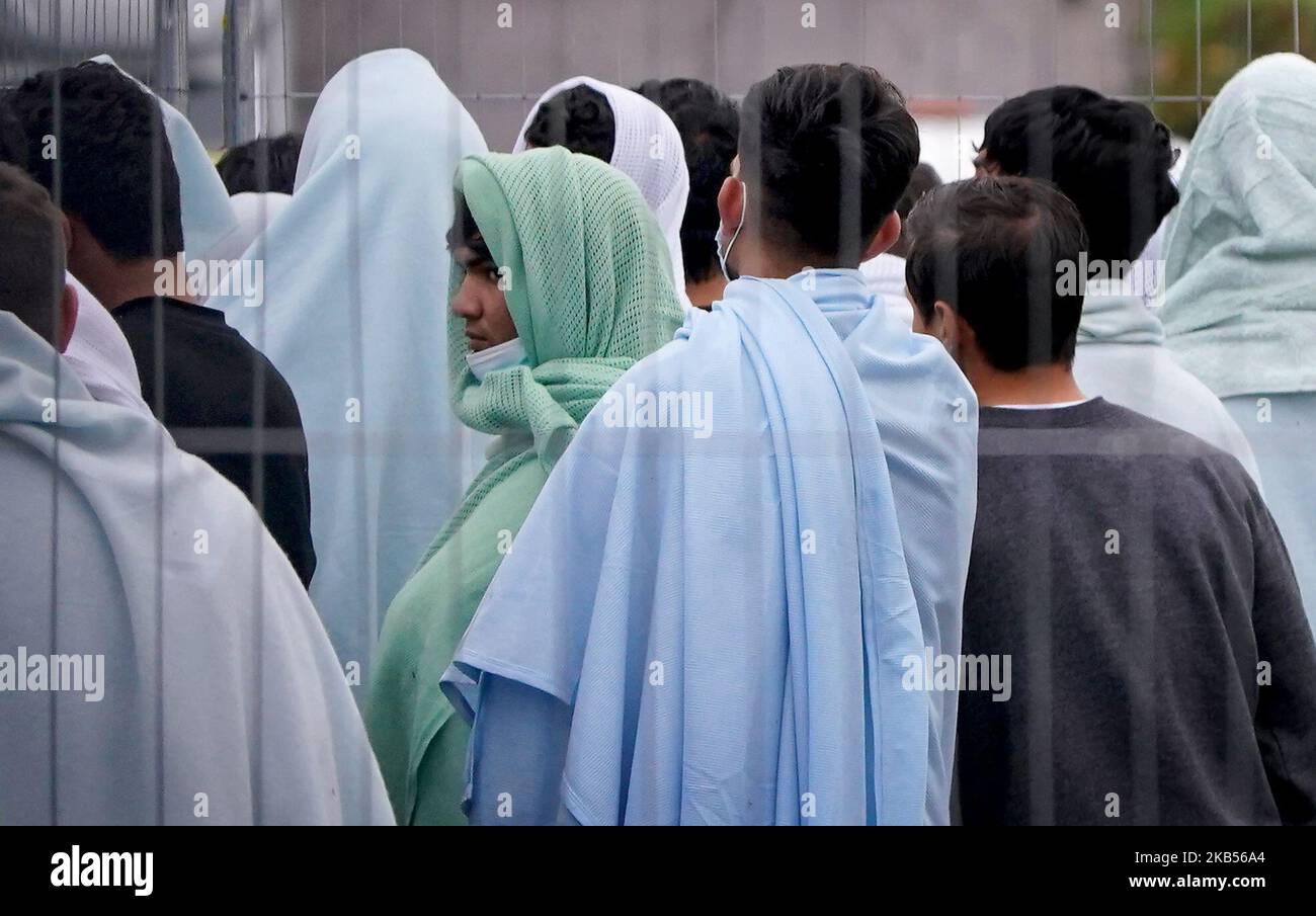 A view of people thought to be migrants inside the Manston immigration ...