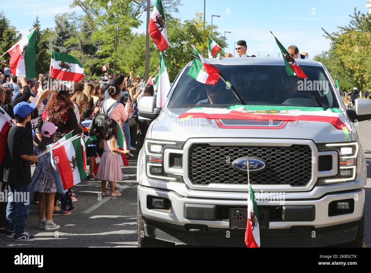 Iranian Canadians hold Iranian flags during the first ever Persian ...