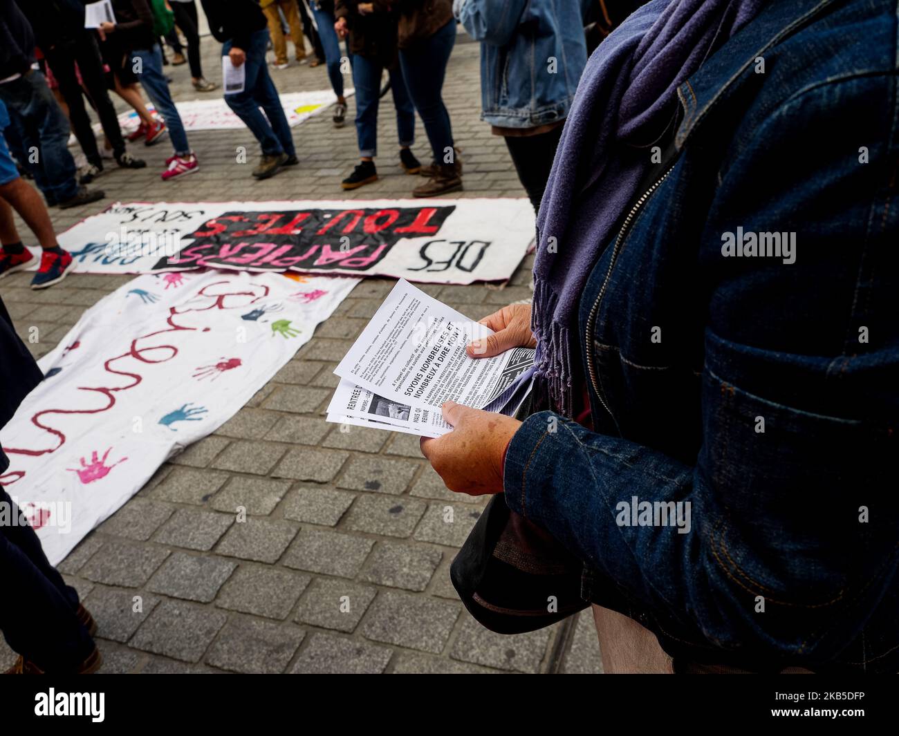 A member of the NGO holding a leaflet at the rally for homeless ...