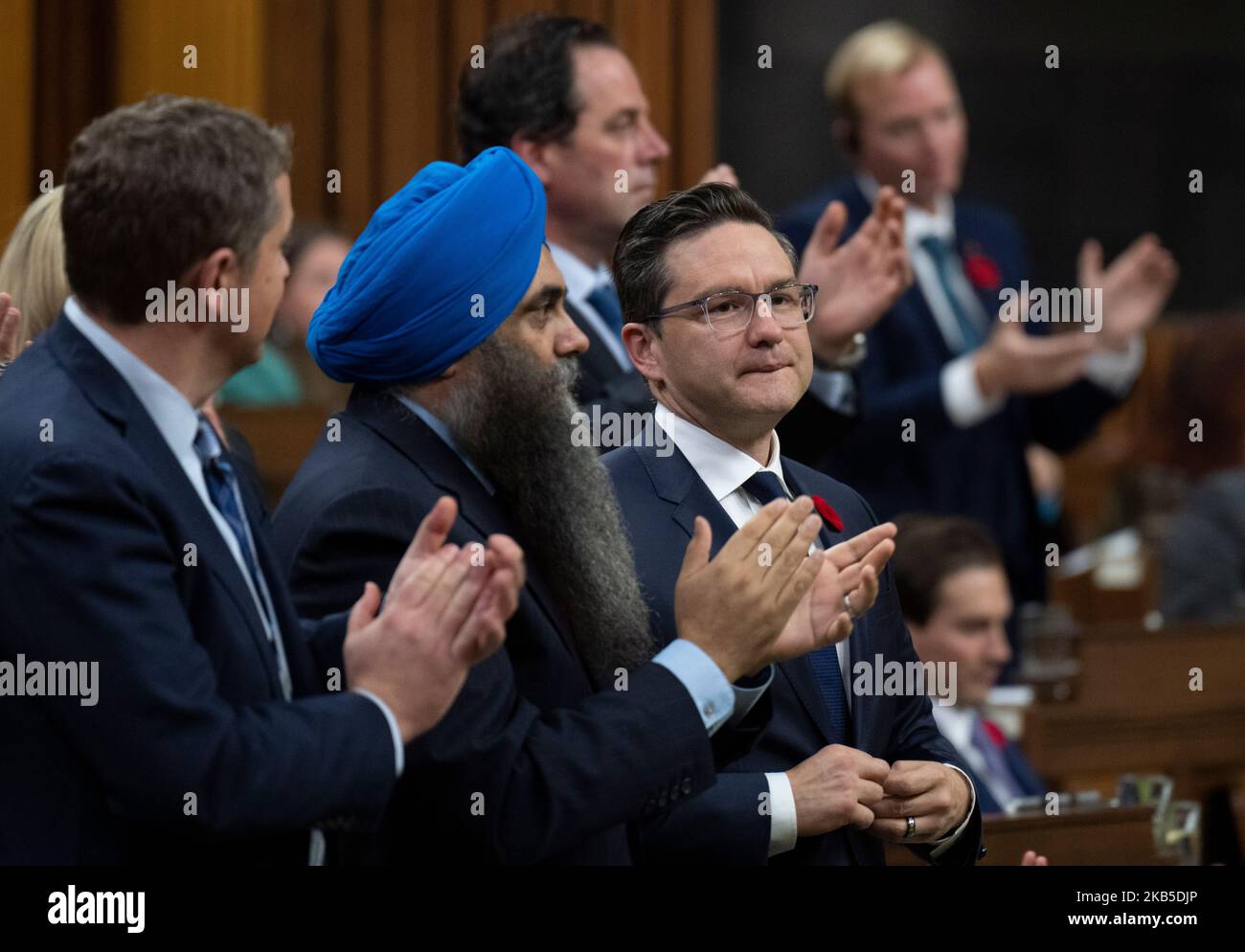 Conservative members applaud Leader Pierre Poilievre as he speaks following the fall economic ...
