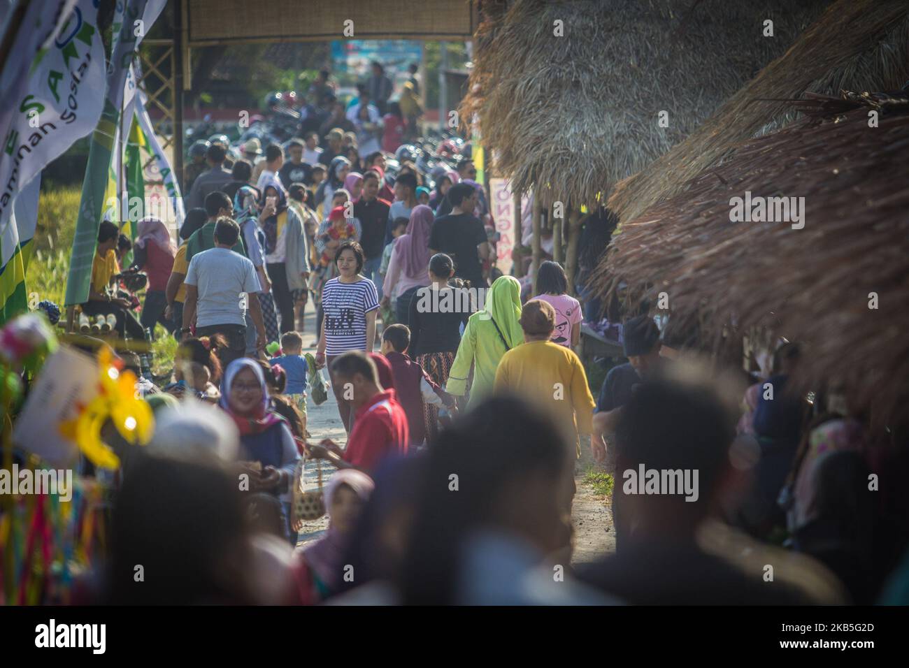 Tourists visit the Sawahan Market, a traditional snack market in ...