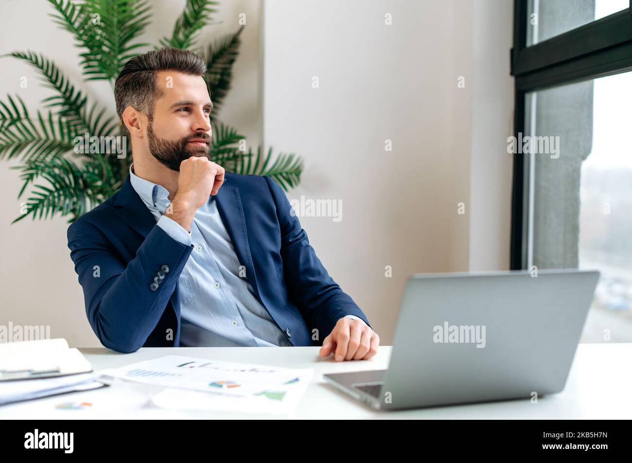 Pensive dreamy caucasian attractive successful businessman, sit at work ...