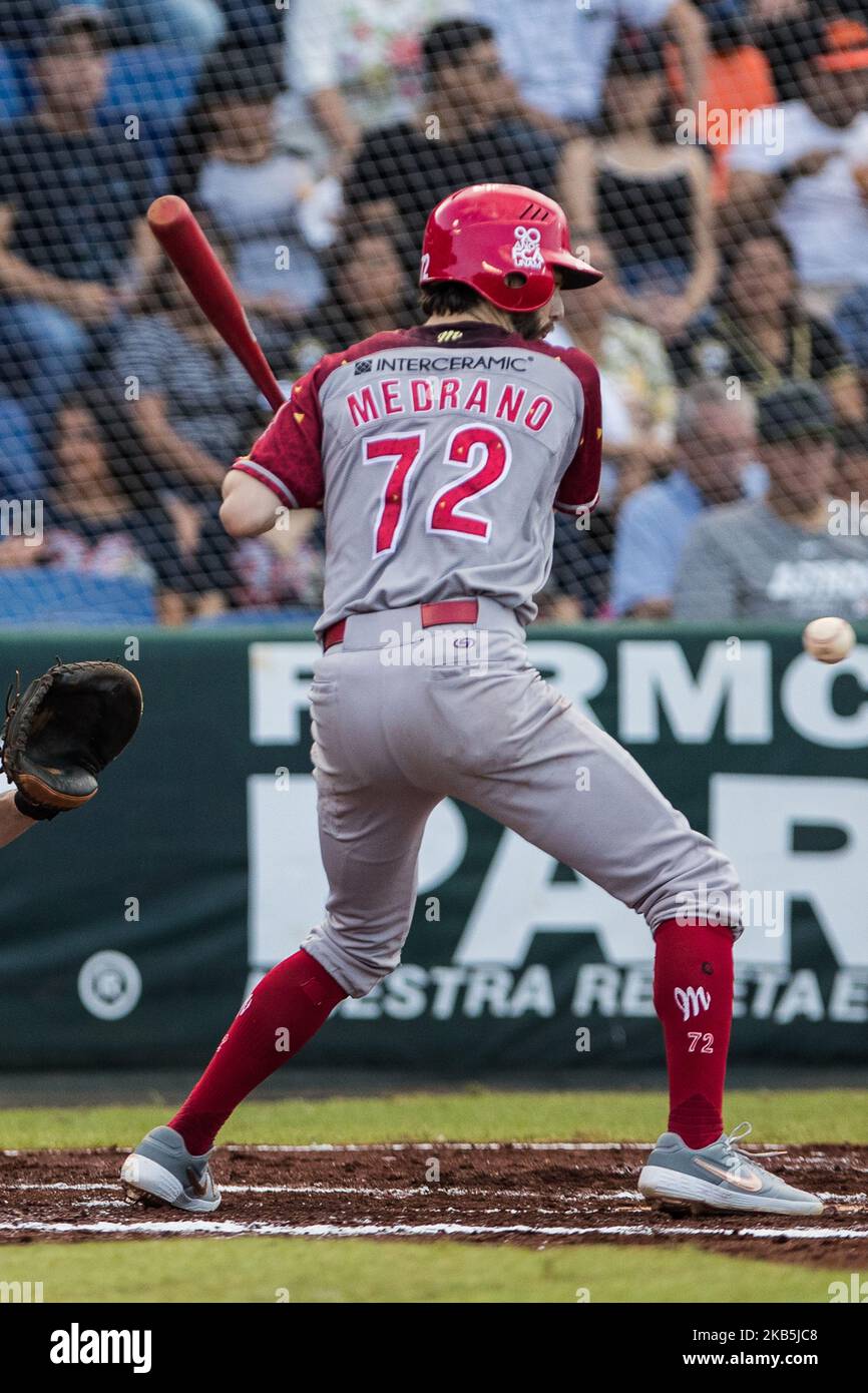 Kevin Medrano of Diablos Rojos #72 hits against of Tigres de Quintana ...