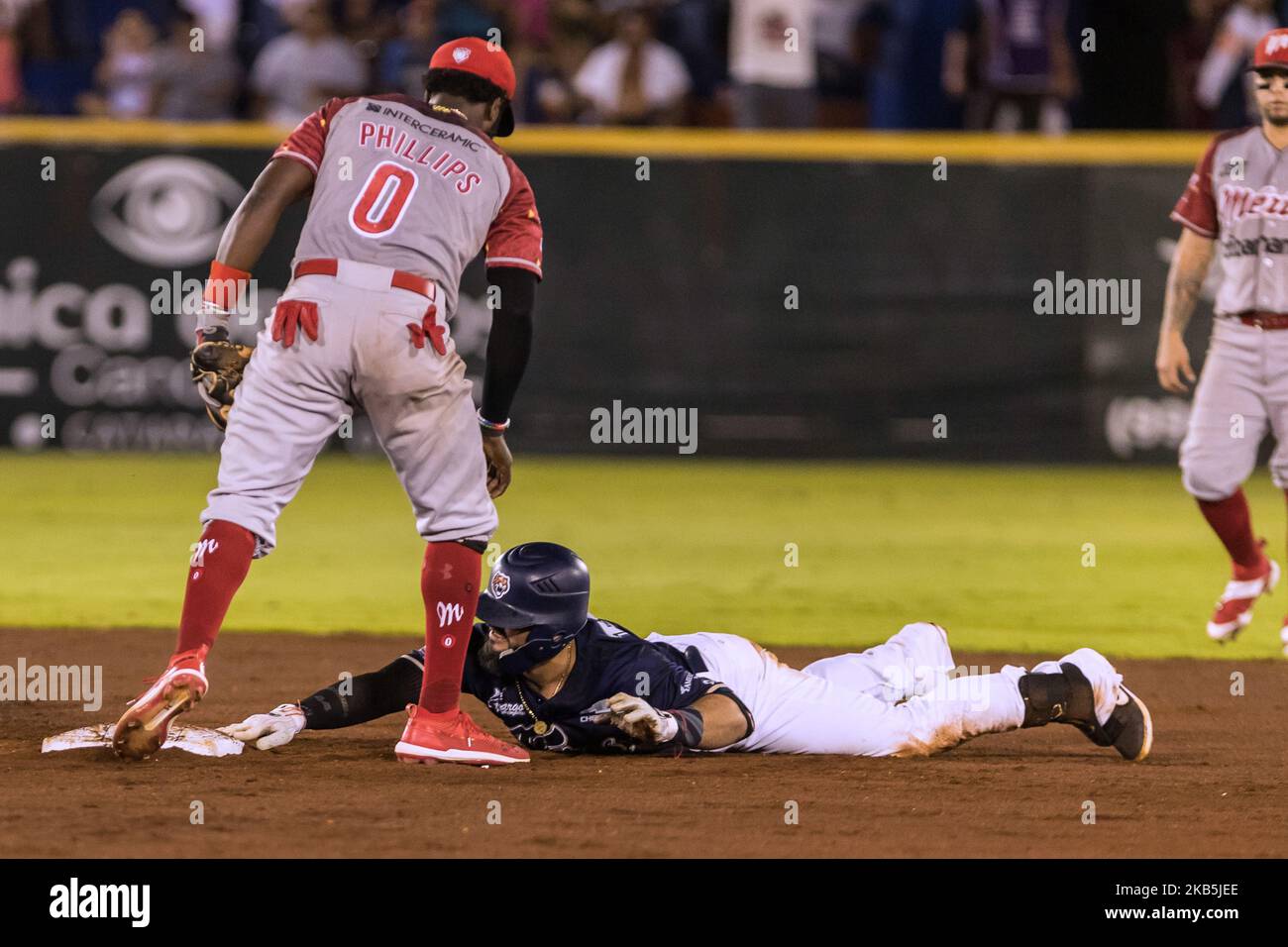 Brian Hernandez of Tigres de Quintana Roo #14 steals the base against ...