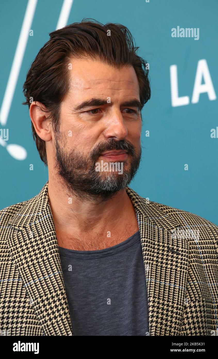 Claes Bang attends "The Burnt Orange Heresy" photocall during the 76th Venice Film Festival at ...