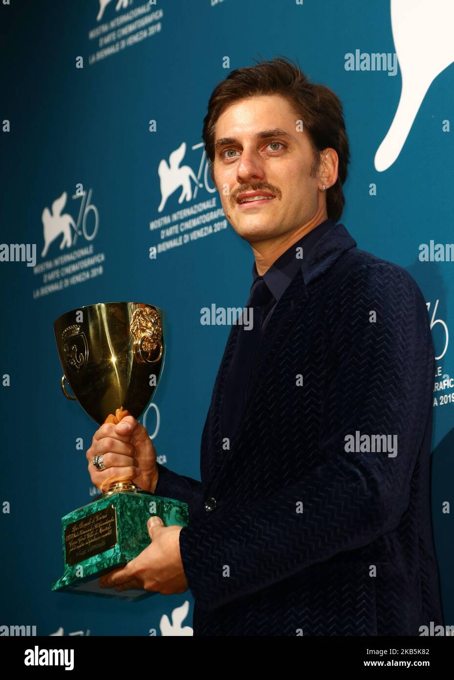Italian actor Luca Marinelli holds the Coppa Volpi for Best Actor he ...
