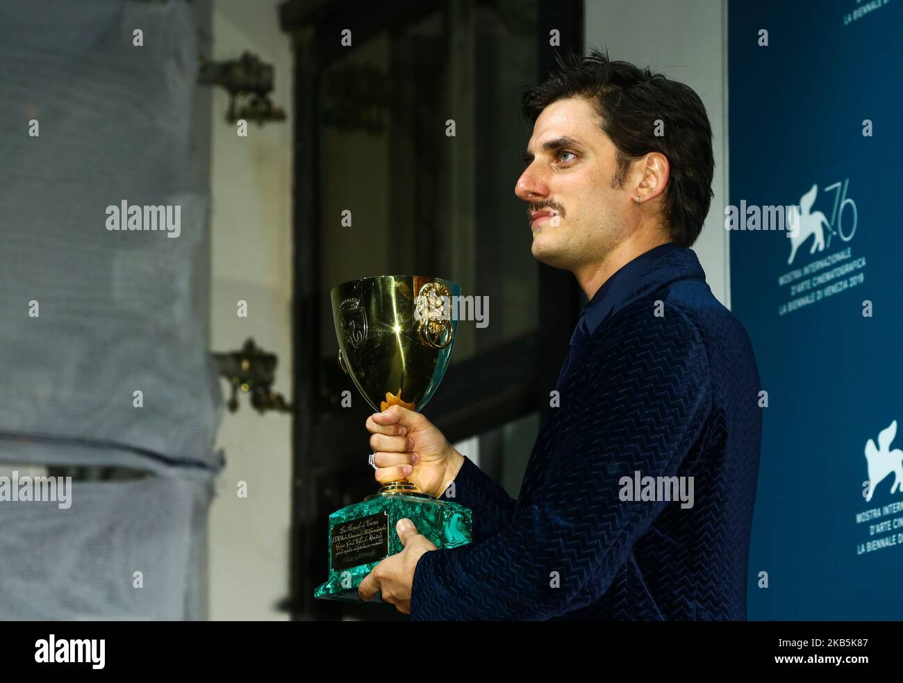 Italian actor Luca Marinelli holds the Coppa Volpi for Best Actor he ...