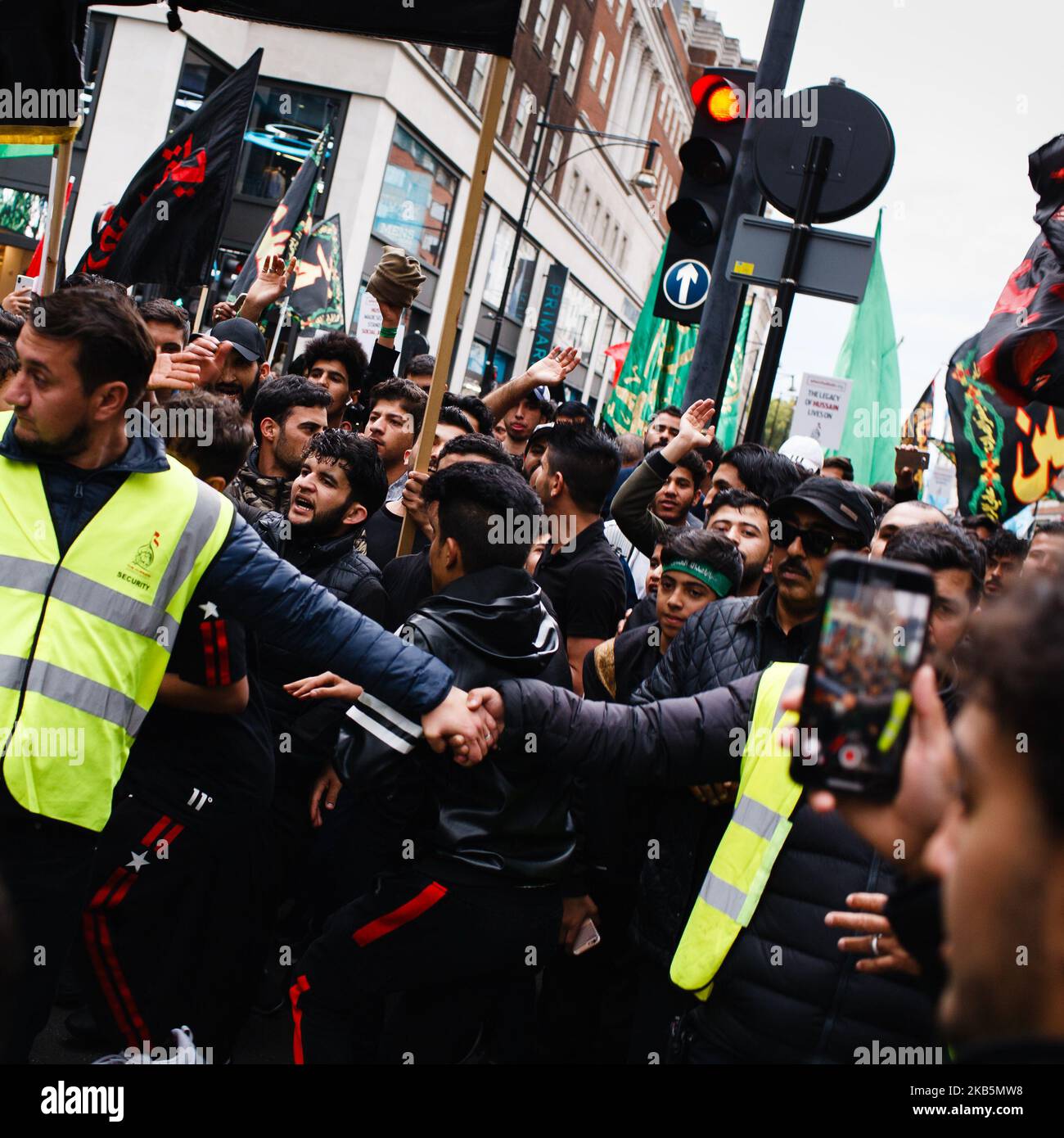 Muslim men marking the day of Ashura dance and jostle along Oxford ...
