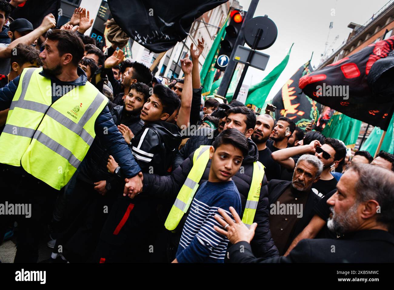 Muslim men marking the day of Ashura dance and jostle along Oxford ...