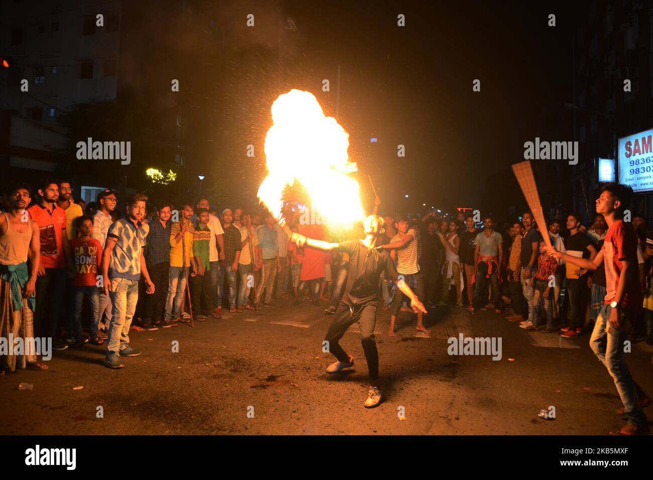 Indian Shiite Muslim fire eaters perform stunts on the occasion of ...