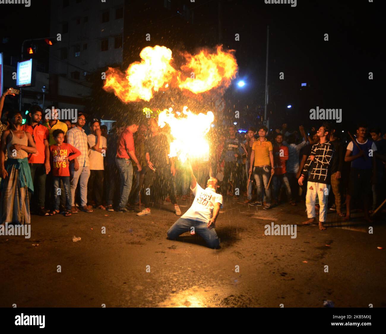 Indian Shiite Muslim fire eaters perform stunts on the occasion of ...