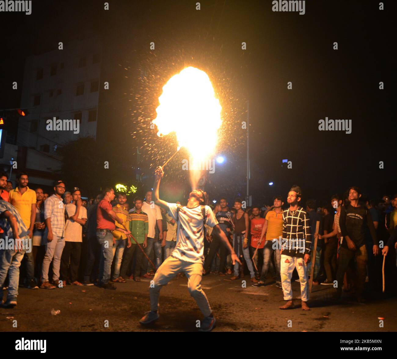 Indian Shiite Muslim fire eaters perform stunts on the occasion of ...