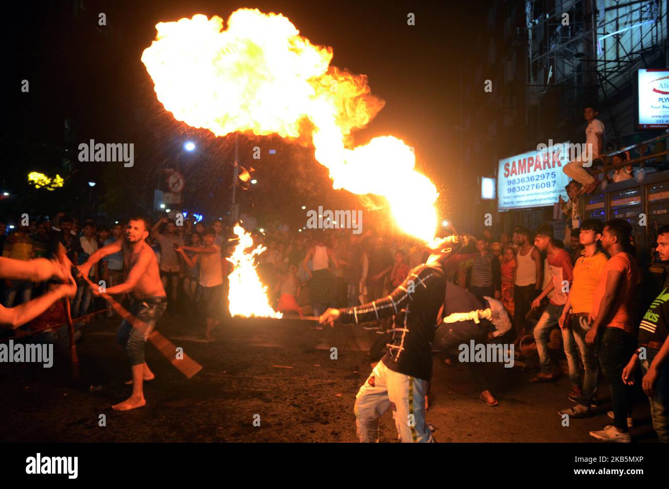 Indian Shiite Muslim fire eaters perform stunts on the occasion of ...
