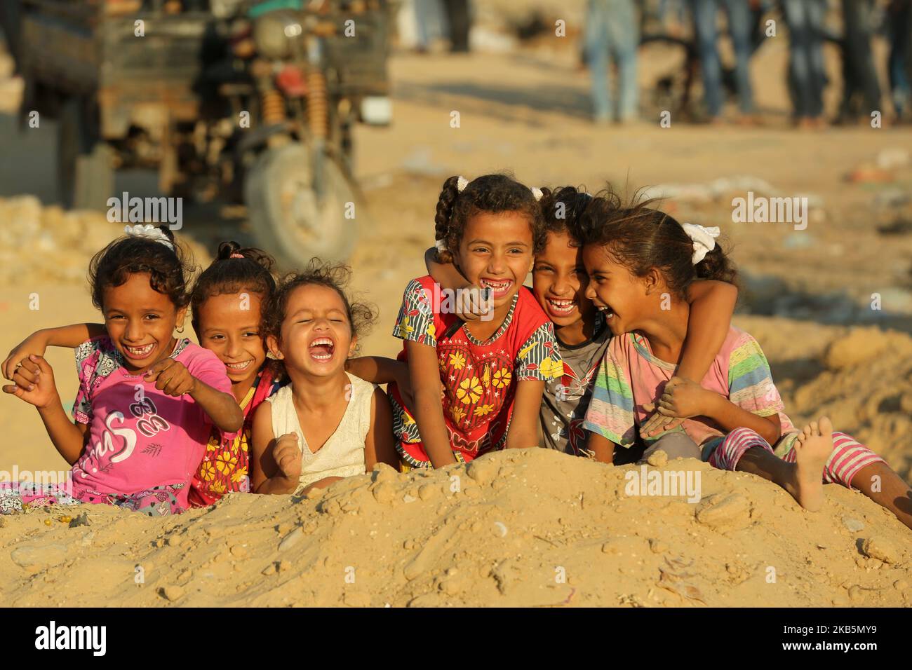 Palestinian children play on the land of Gaza destroyed airport, in ...