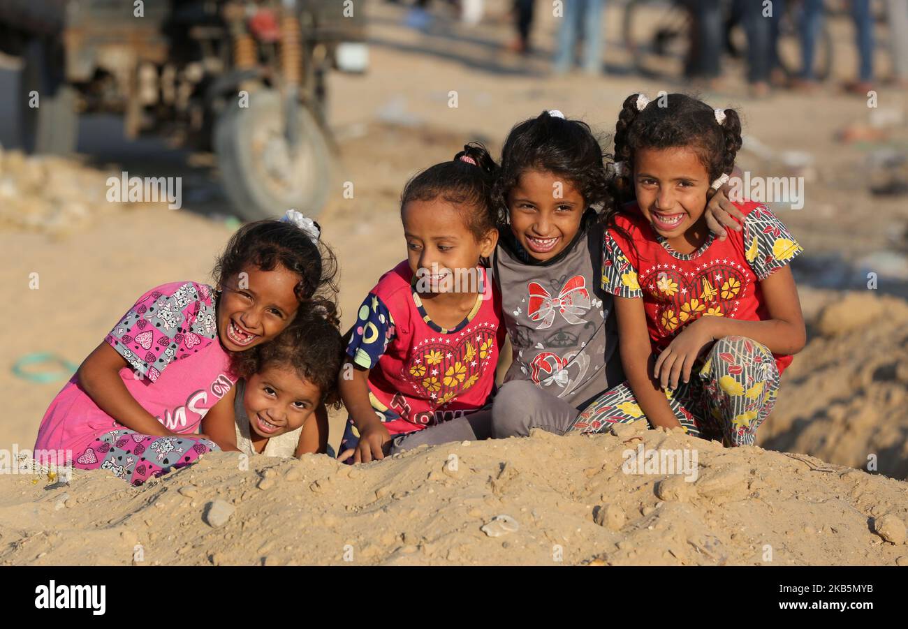 Palestinian children play on the land of Gaza destroyed airport, in ...