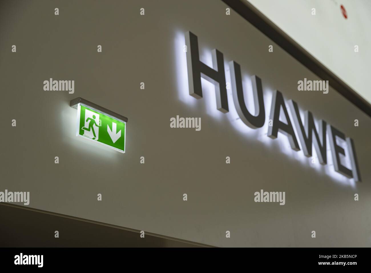 Huawei logo and emergency exit sign are pictured during the ...