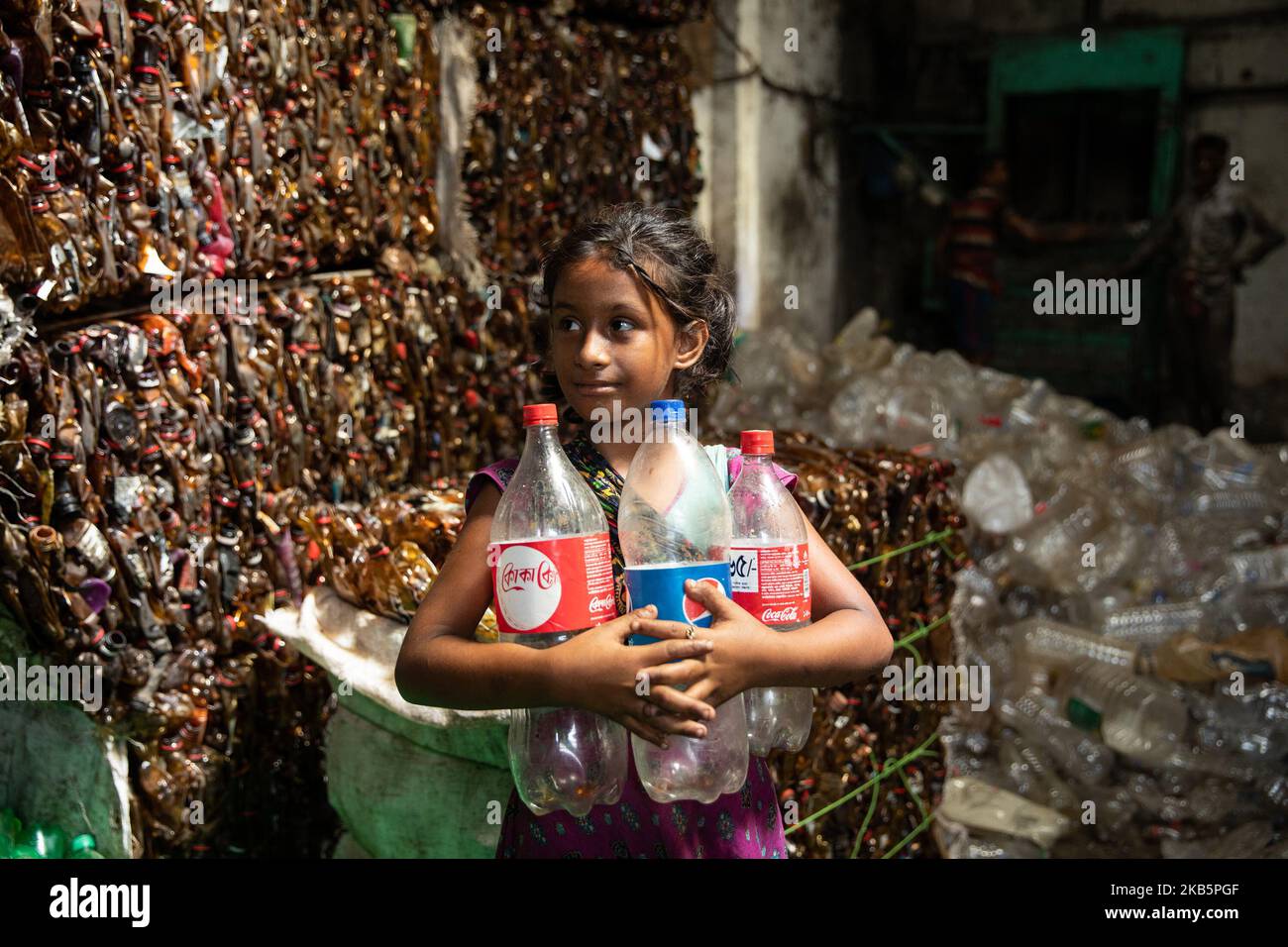 Child work in a plastic bottle recycle factory located in Dhaka ...