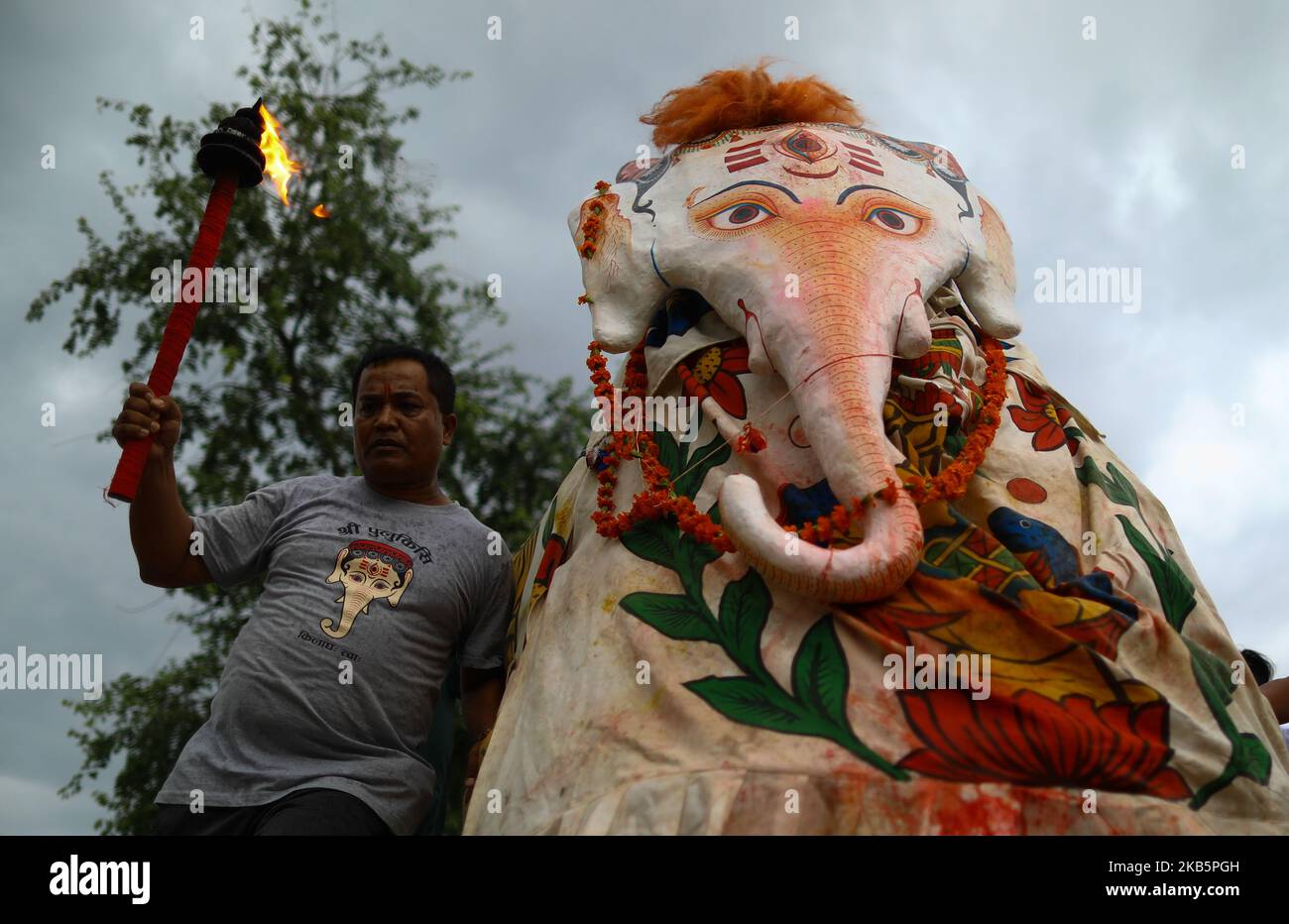 Nepalese mask dancer known as Pullu kishi(white elephant) is pictured ...