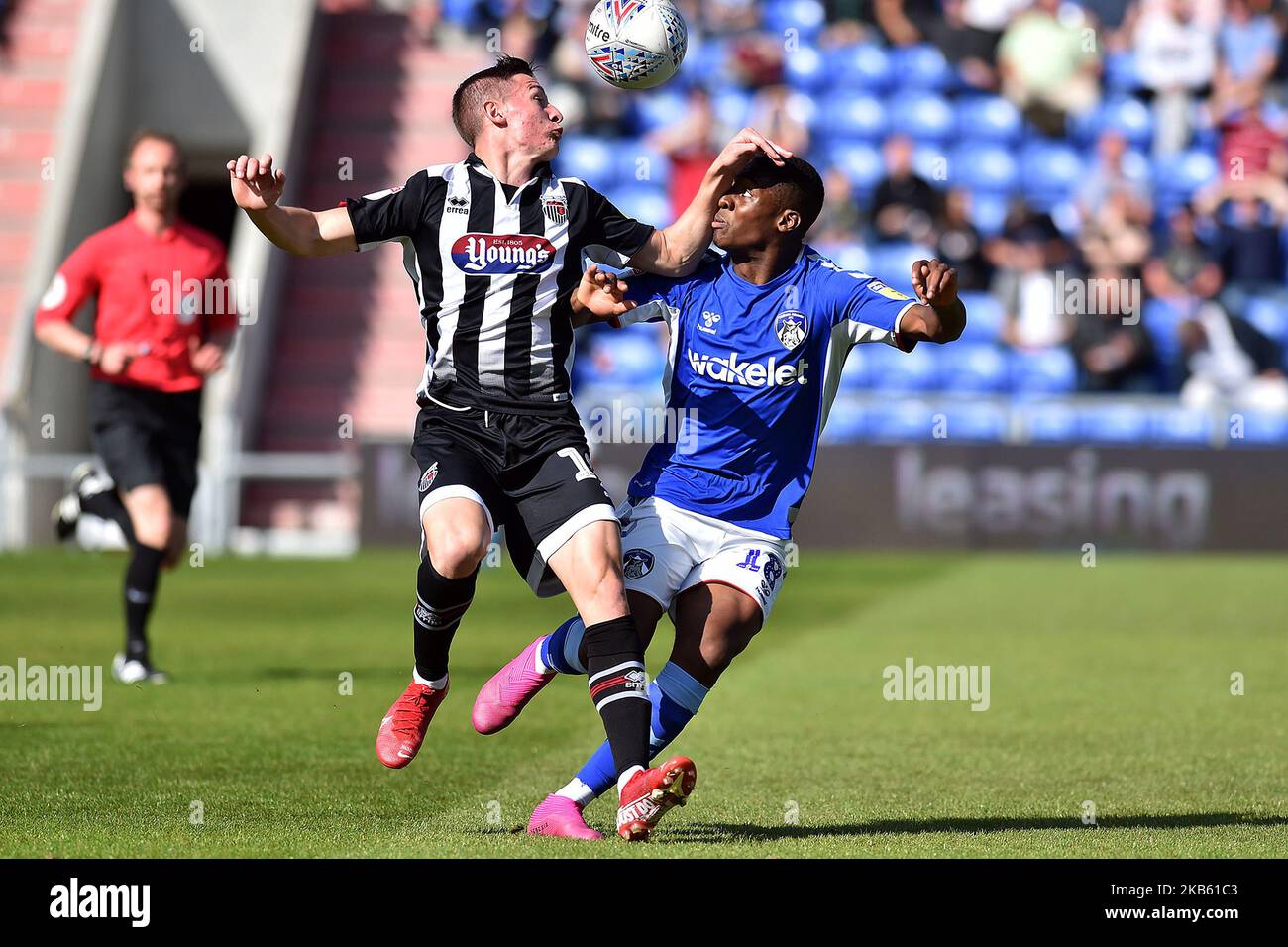 Oldham's Dylan Fage and Grimsby's Jordan Cook in action during the Sky ...