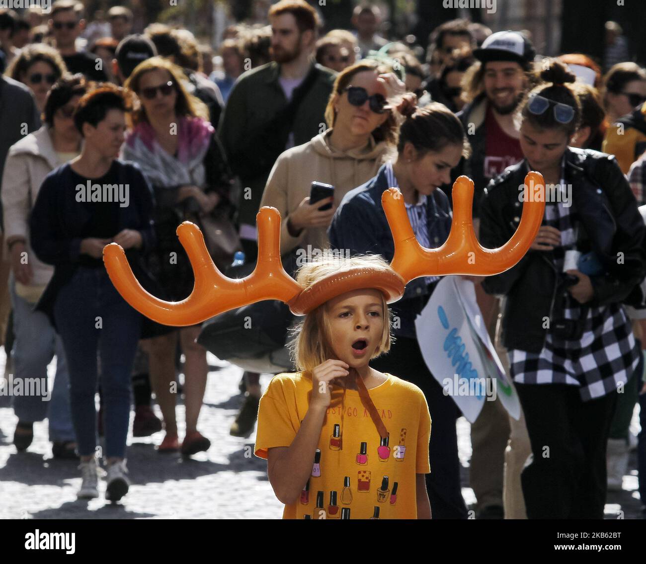 A child attends the 'All-Ukrainian march for animal rights' in center ...