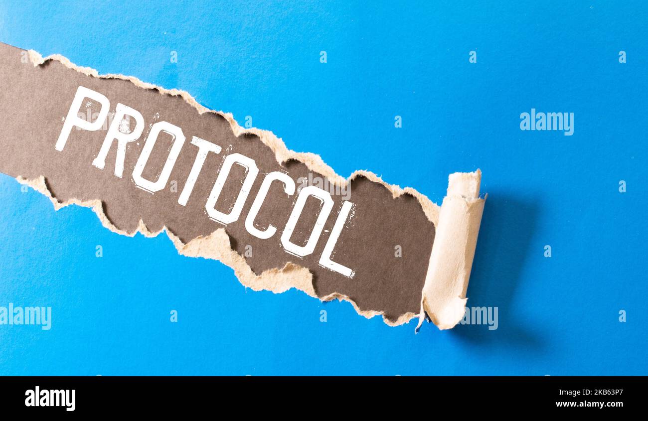 PROTOCOL word written on wood block. PROTOCOL text on wooden table for ...