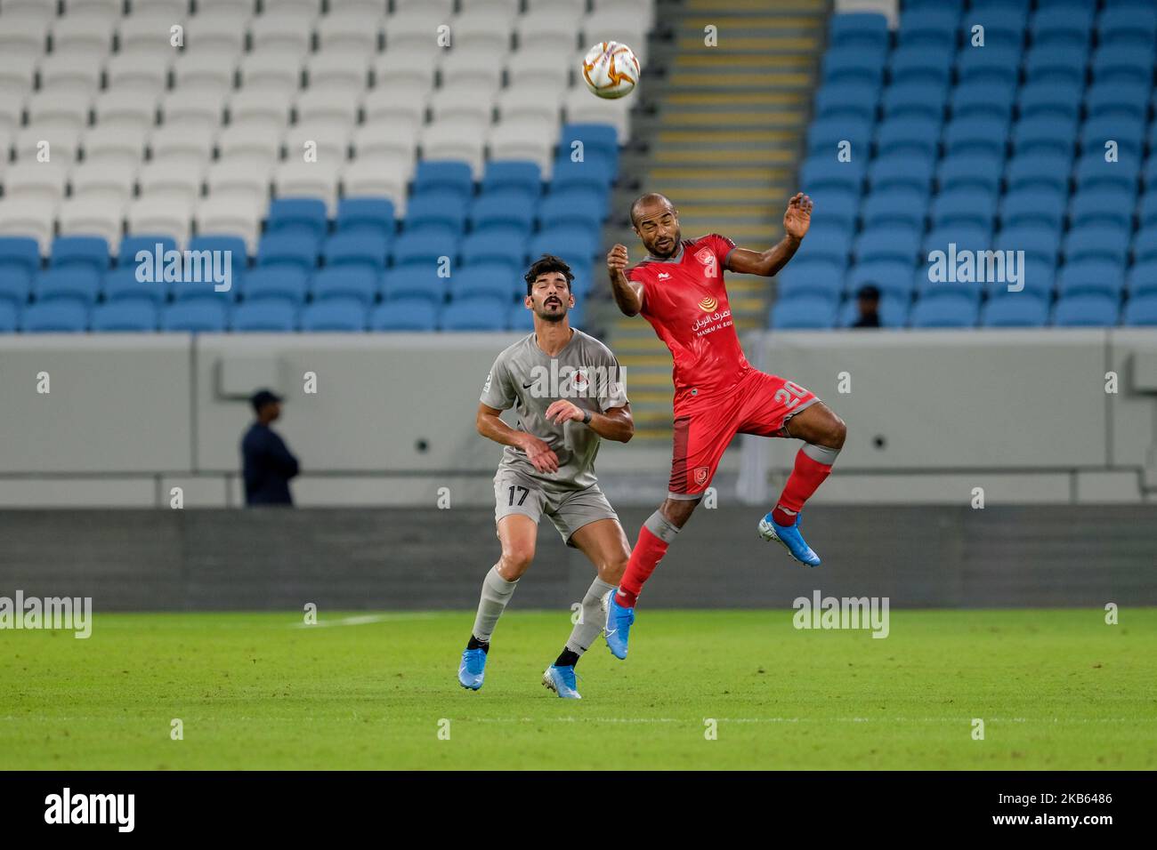 Ali Afif wins a header against Abdalaziz Hazaa Al Hasia during Al ...